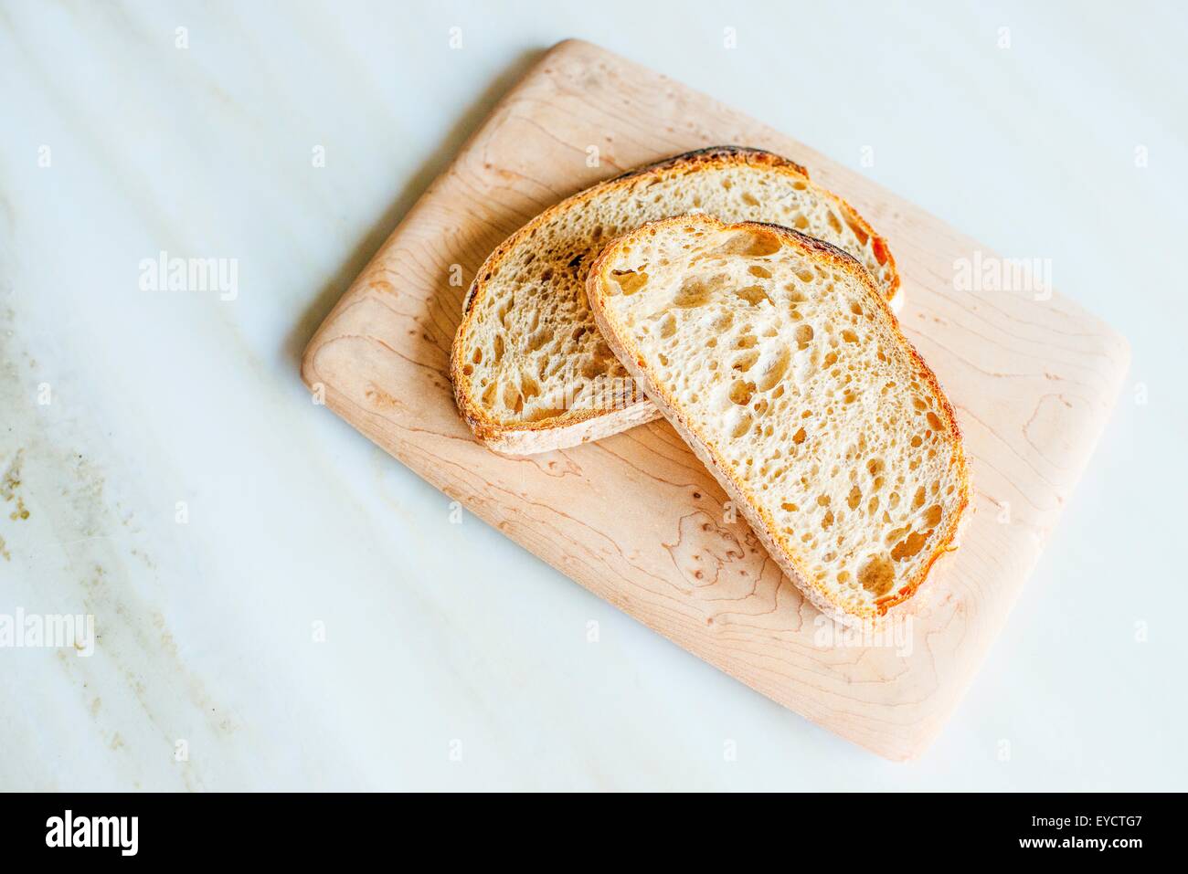 Still life with toast and cutting board Stock Photo - Alamy