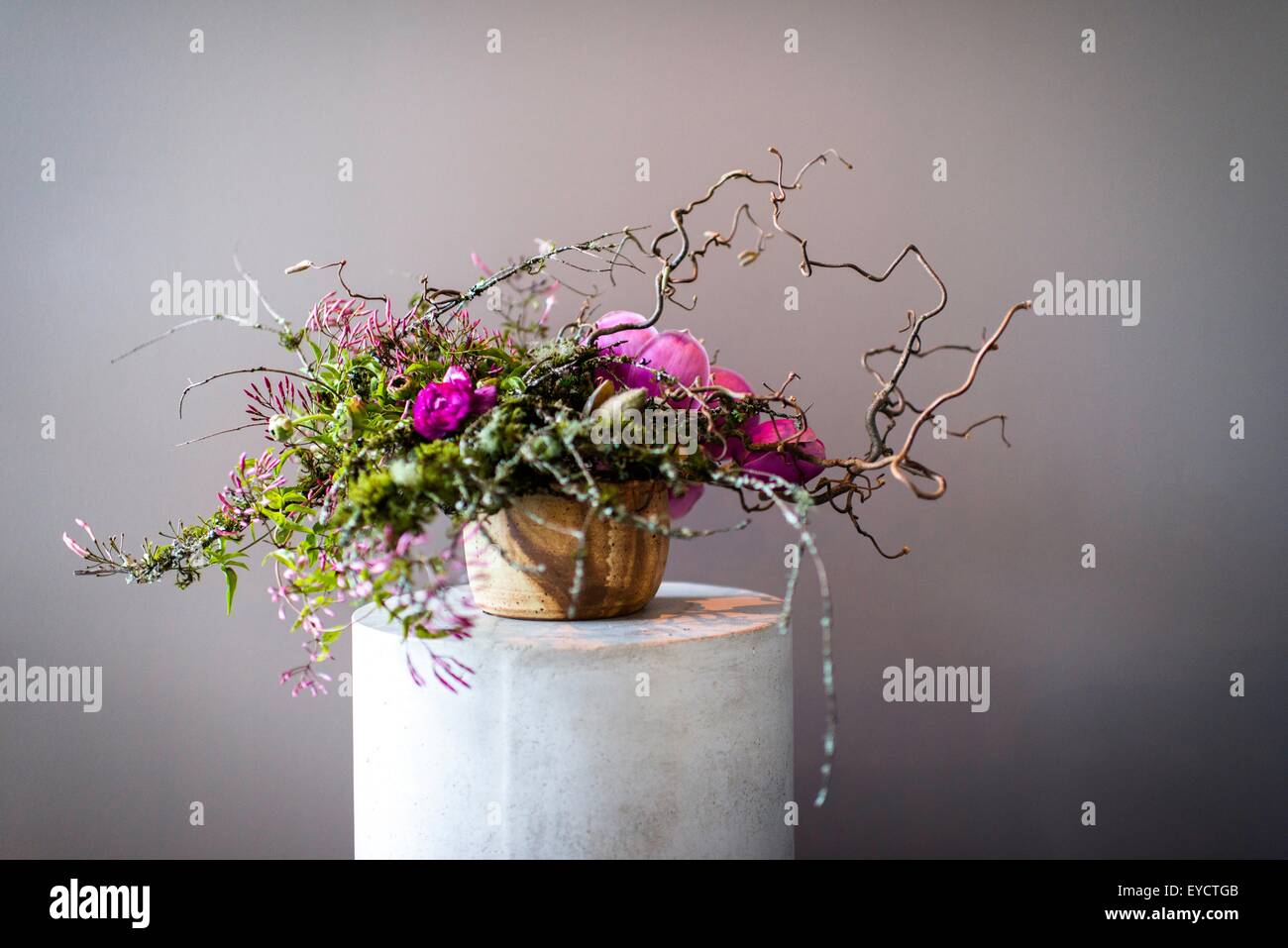Still life of flower arrangement on plinth Stock Photo - Alamy