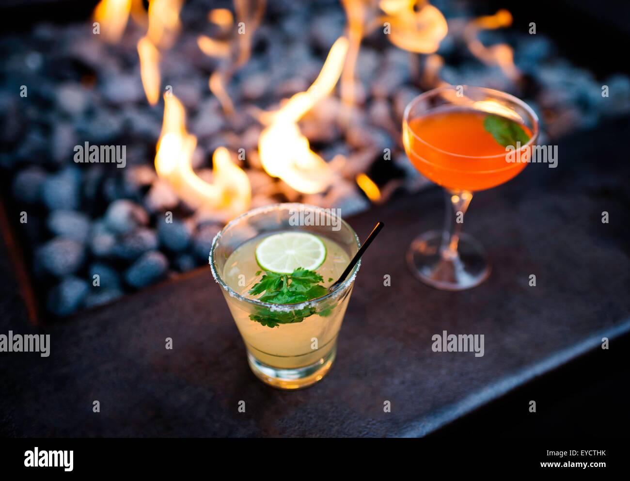 Two cocktails by restaurant open fire Stock Photo - Alamy
