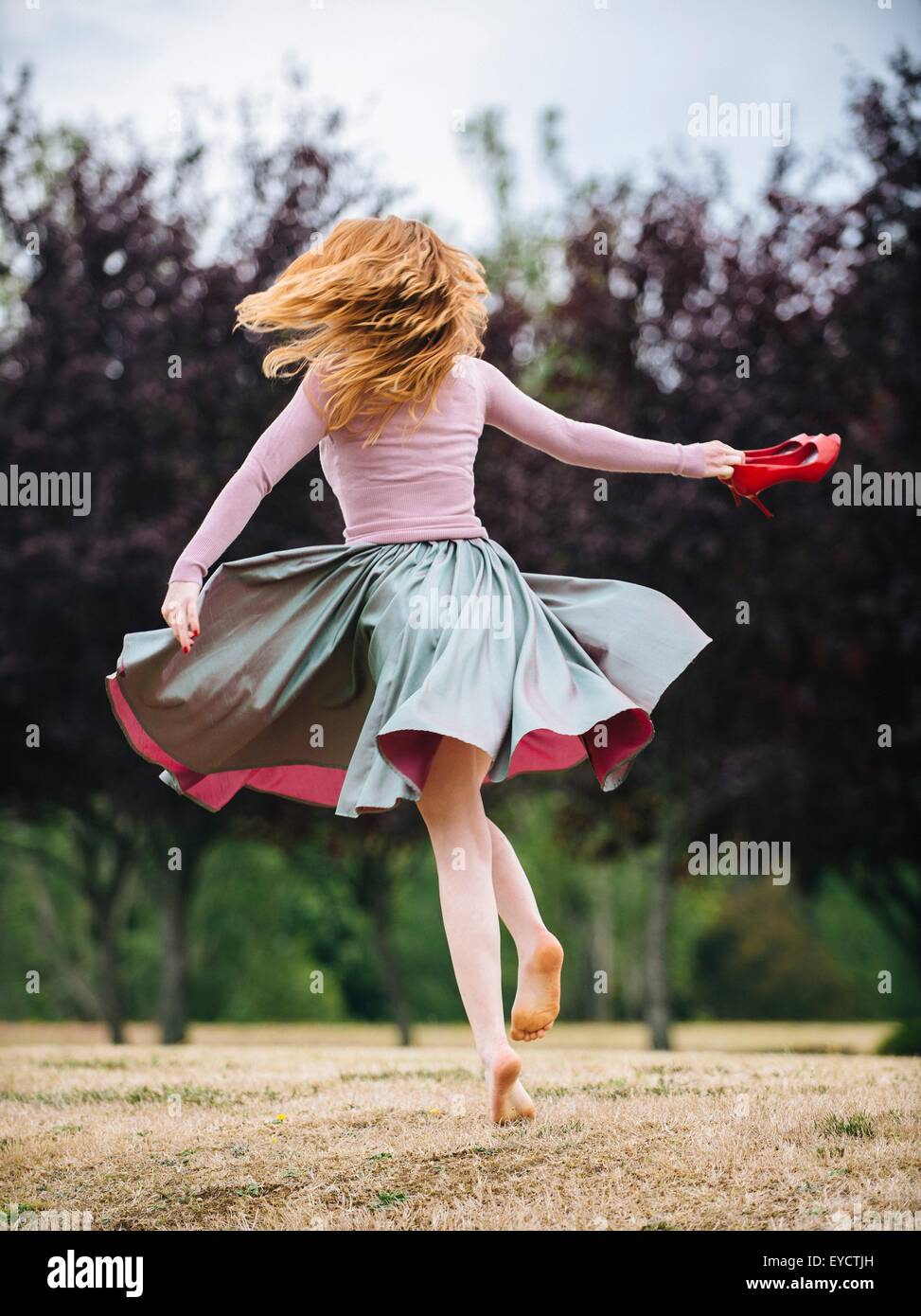 Woman twirling hair around hi-res stock photography and images - Alamy