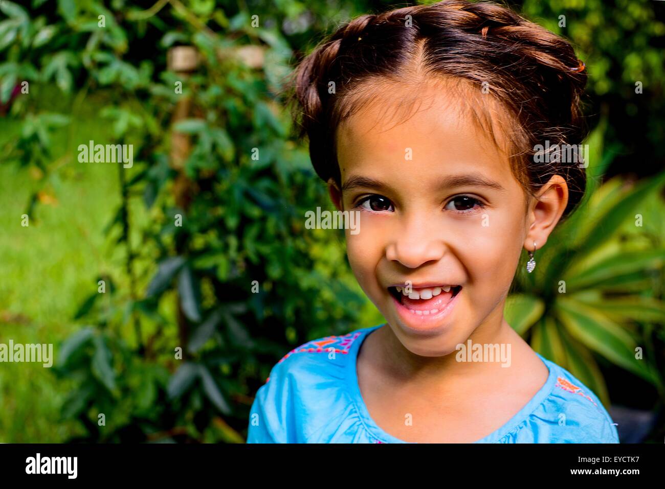 Portrait of pretty girl in garden Stock Photo - Alamy