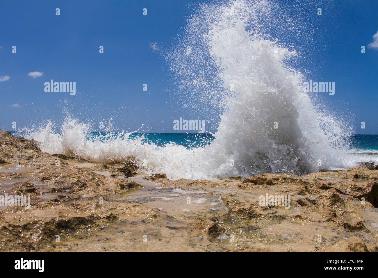 Ocean wave on rocks Stock Photo - Alamy