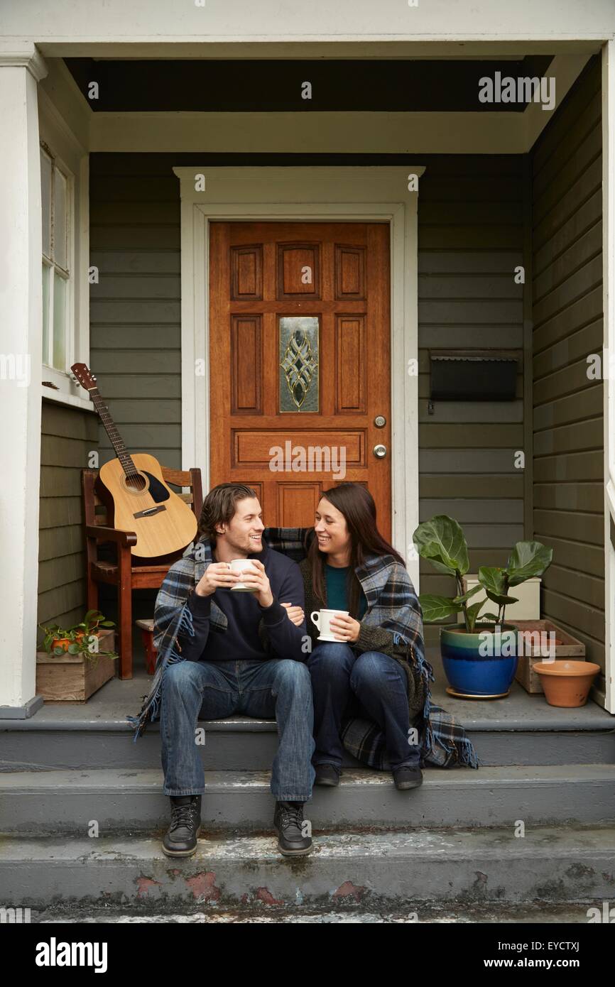 Smiling man sitting on porch hi-res stock photography and images - Alamy