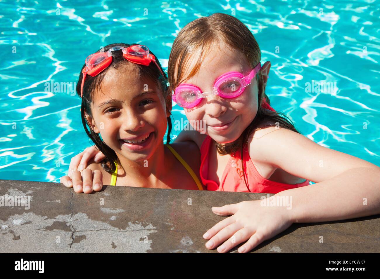 Best friends at poolside Stock Photo - Alamy