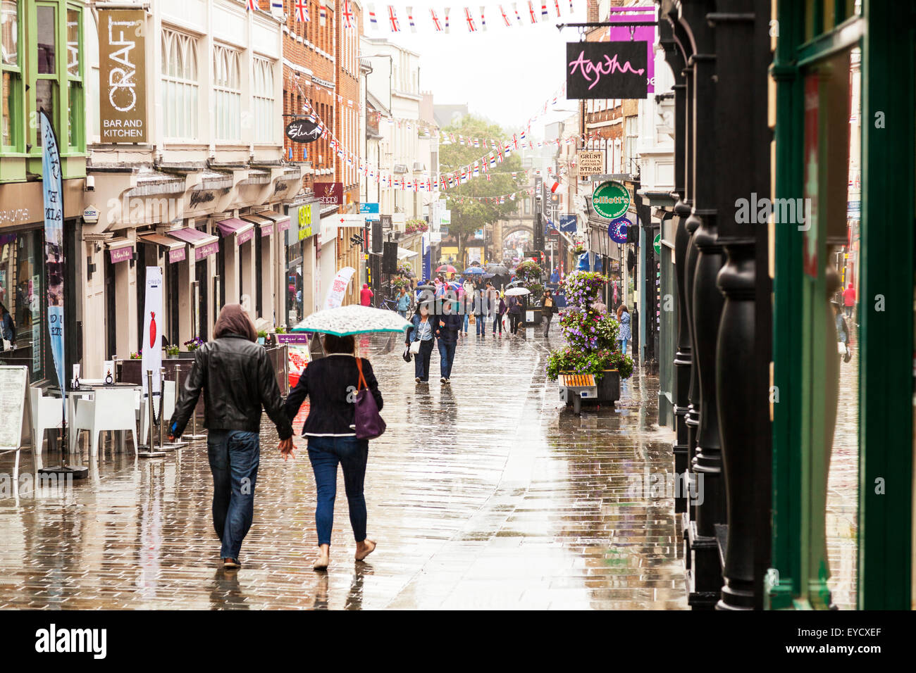 Raining under umbrella rain falling bad weather keeping dry in Lincoln ...