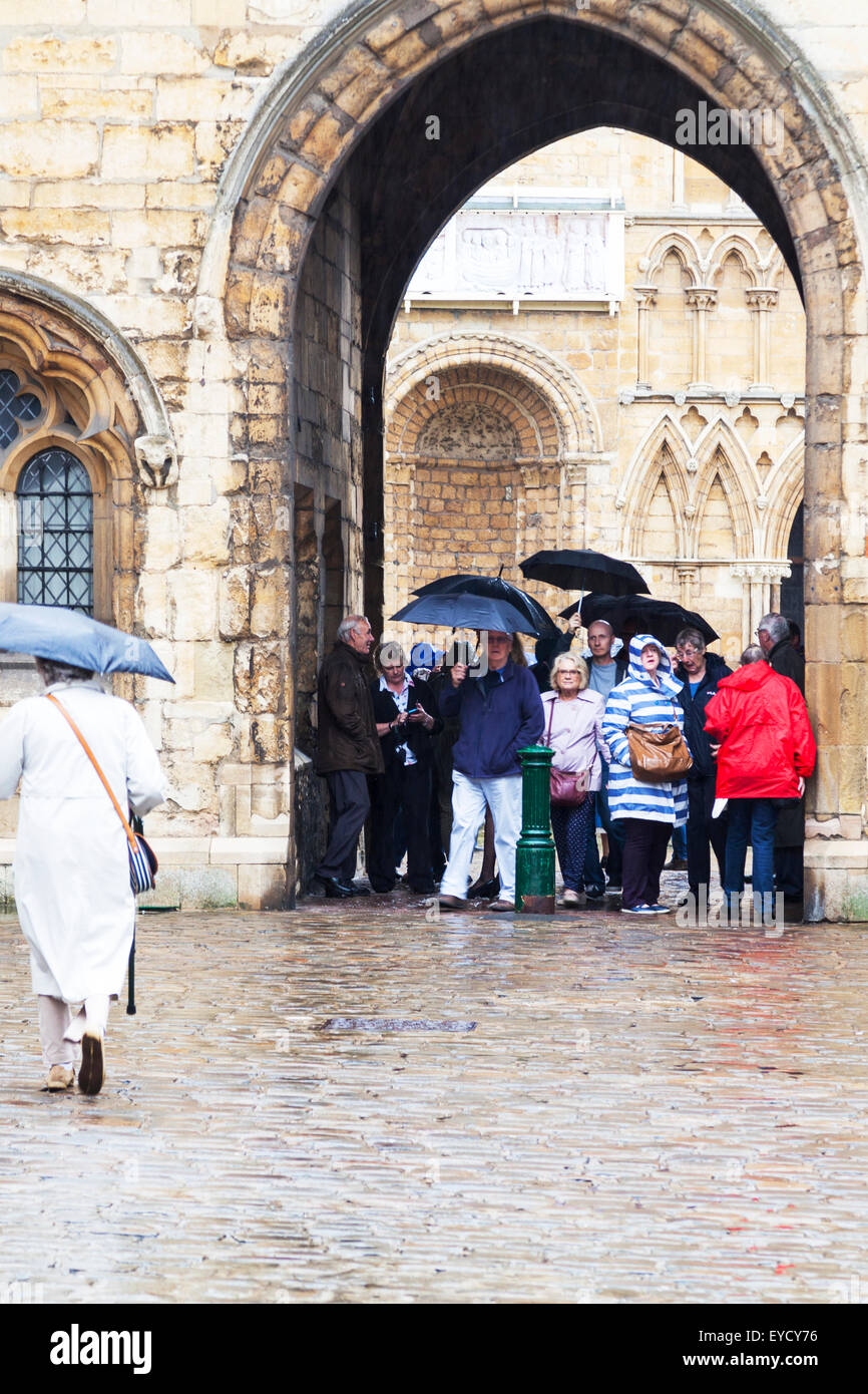 Sheltering under umbrellas in rain rainy day bad weather shelter under ...