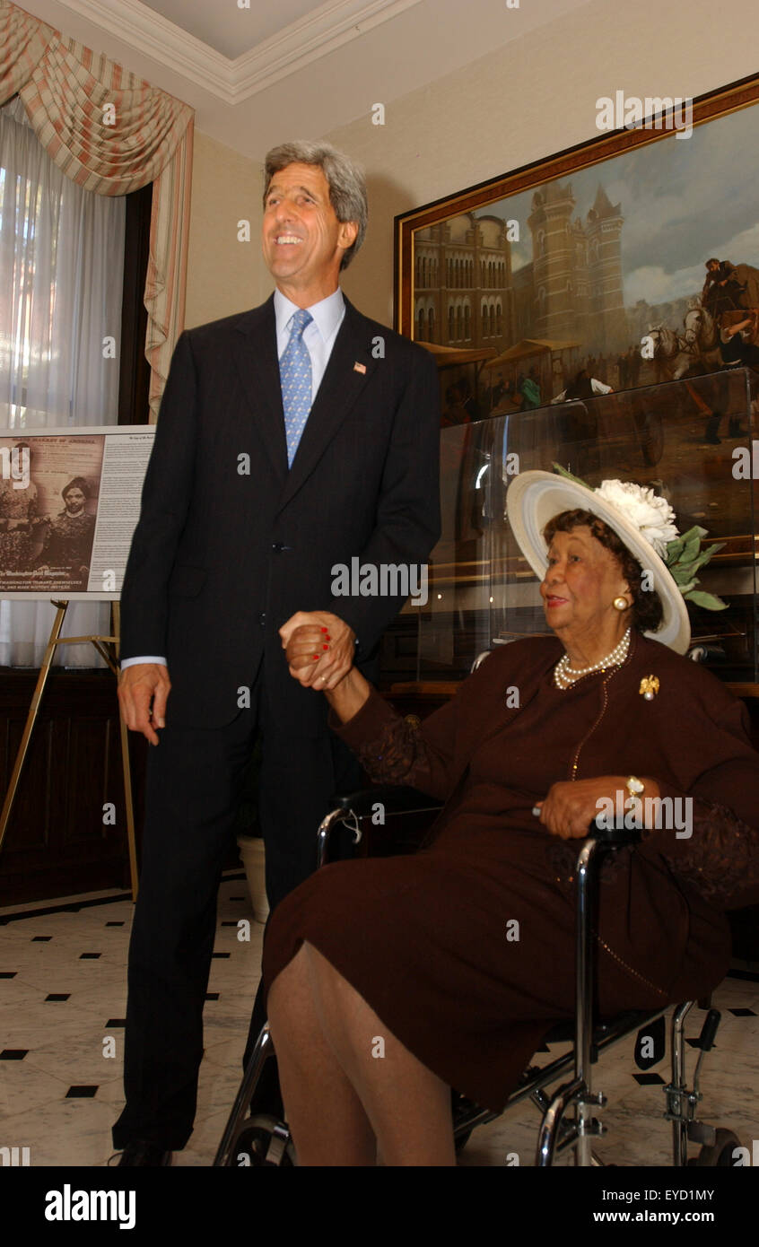 Senator John Kerry (D-MA) receives the book "Open Wide the Freedom ...