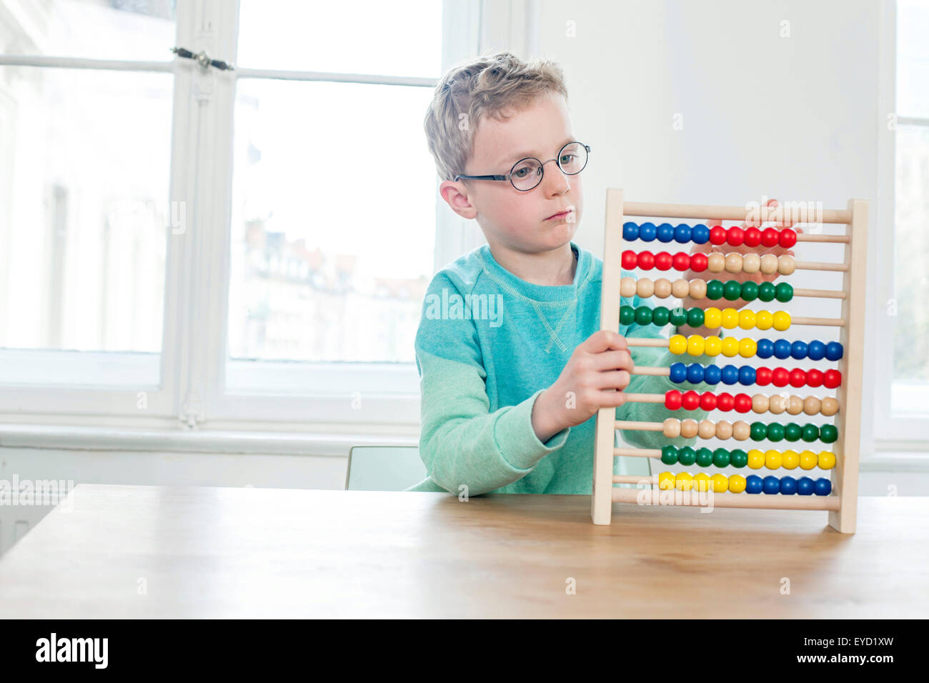 Boy calculating with abacus Stock Photo - Alamy Boy calculating with abacus Stock Photo - Alamy