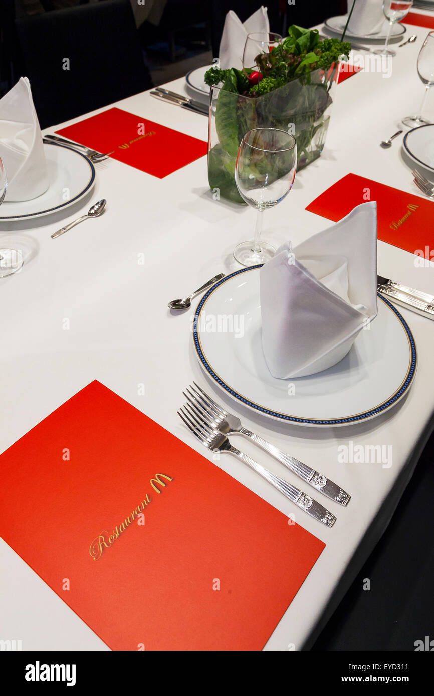White tablecloth and fancy tableware set for 20 lucky customers who ...