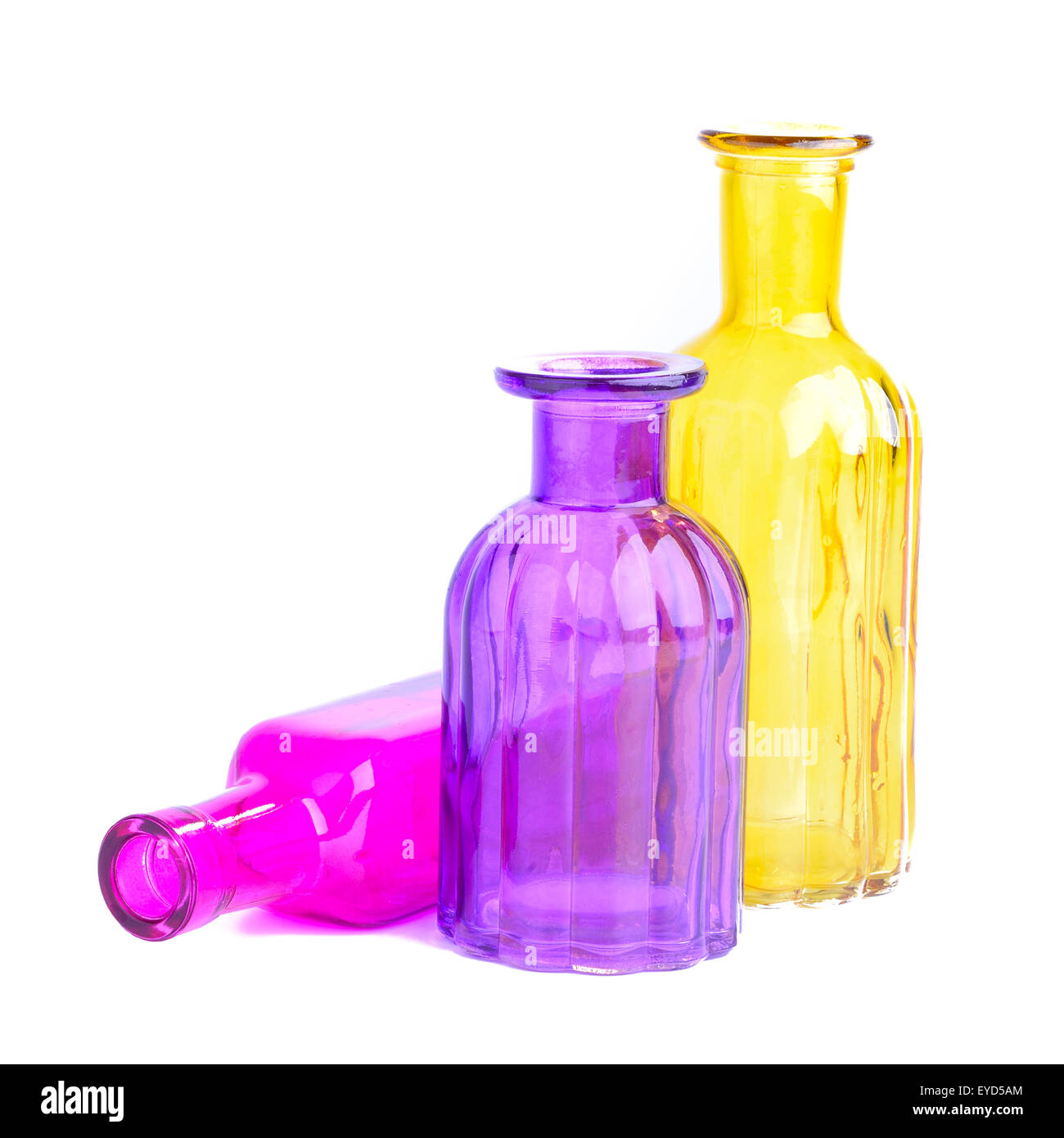 Three colorful bottles, isolated on white background Stock Photo - Alamy