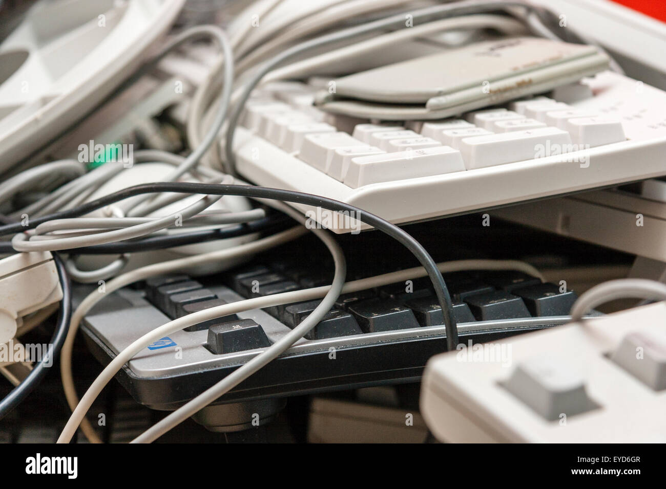 Junked computers stored in room. Piles of stacked white obsolete ...