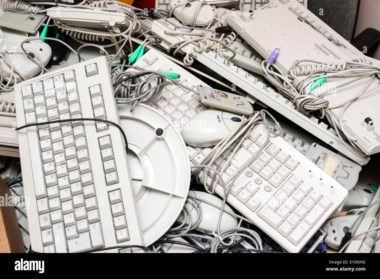 Junked computers stored in room. Piles of stacked white obsolete ...