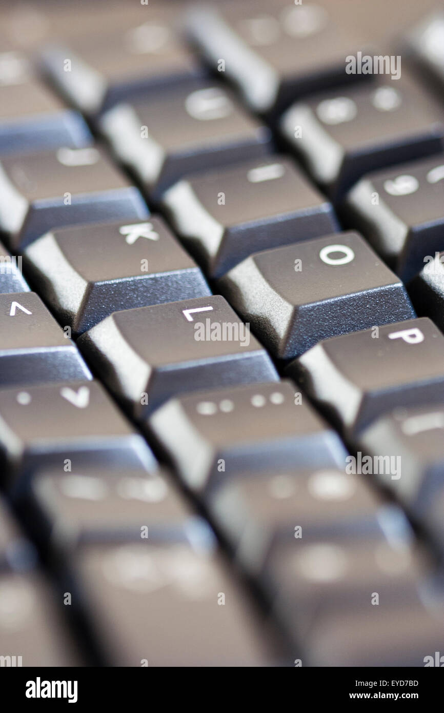 View along dark grey computer keyboard input device. Showing various ...