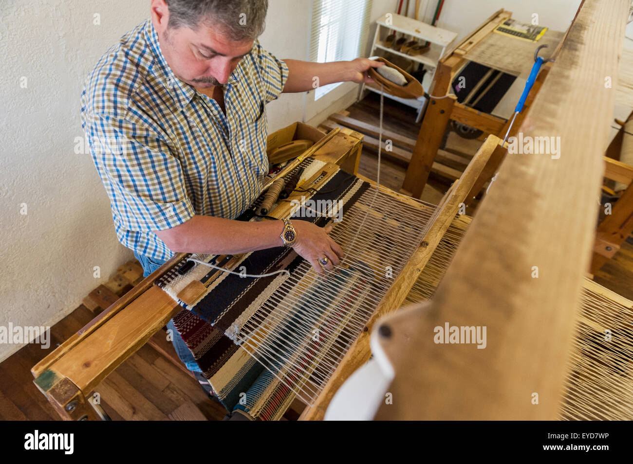 High Angle View Of A Man Making Loom Demonstration At Ortega's Weaving ...