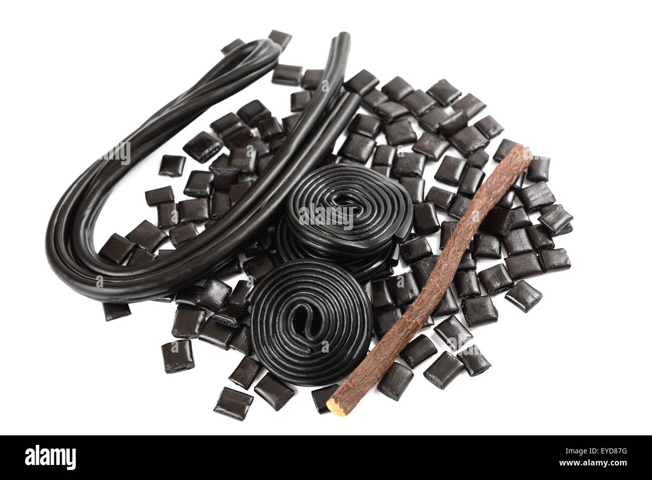 Licorice roots and candies on white background Stock Photo - Alamy