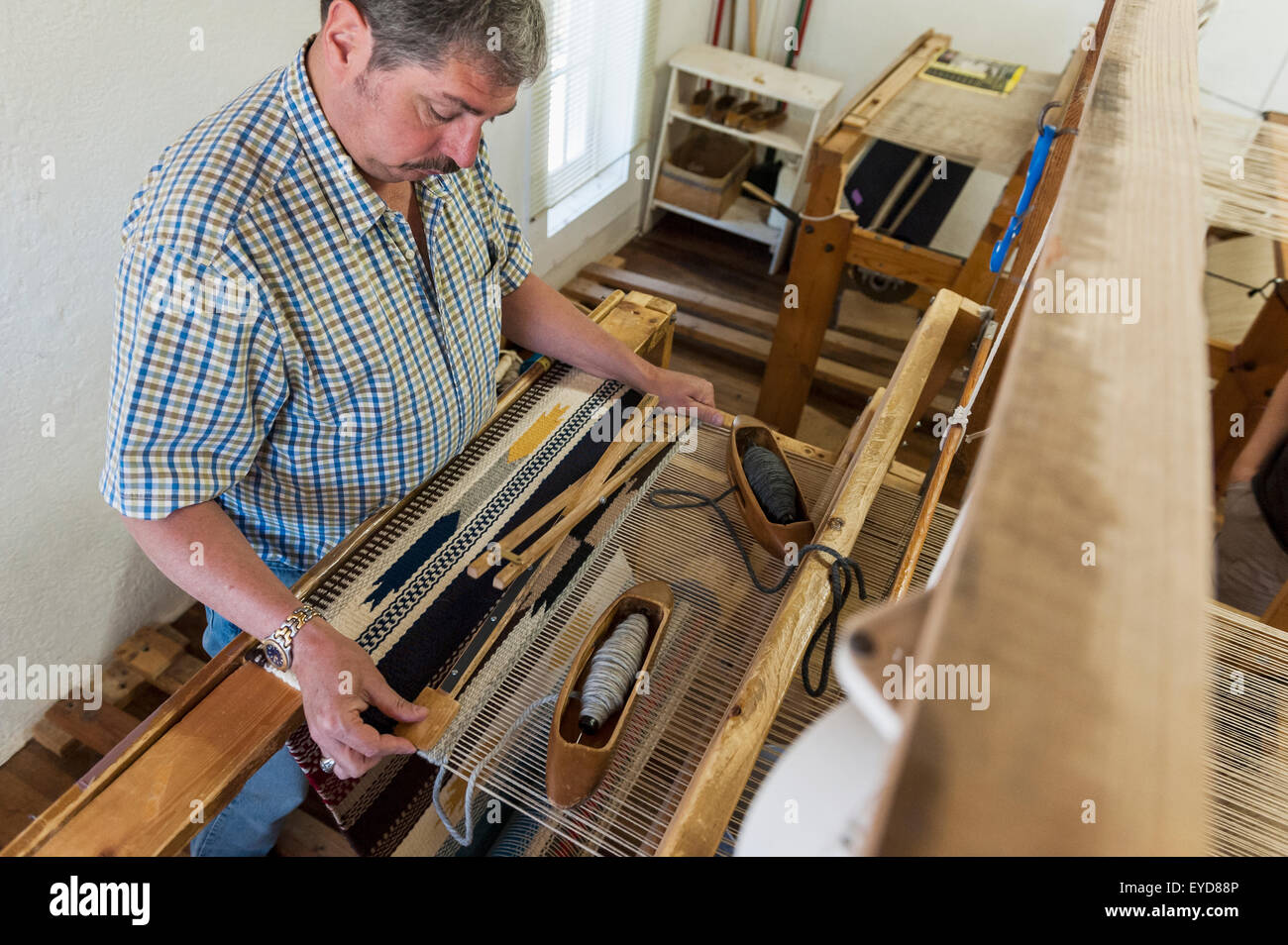 High Angle View Of A Man Working On Loom Demonstration At Ortega's ...