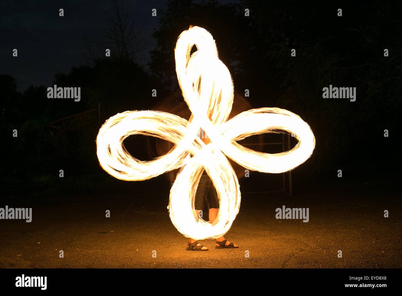 Fire-show man in action in night time Stock Photo - Alamy