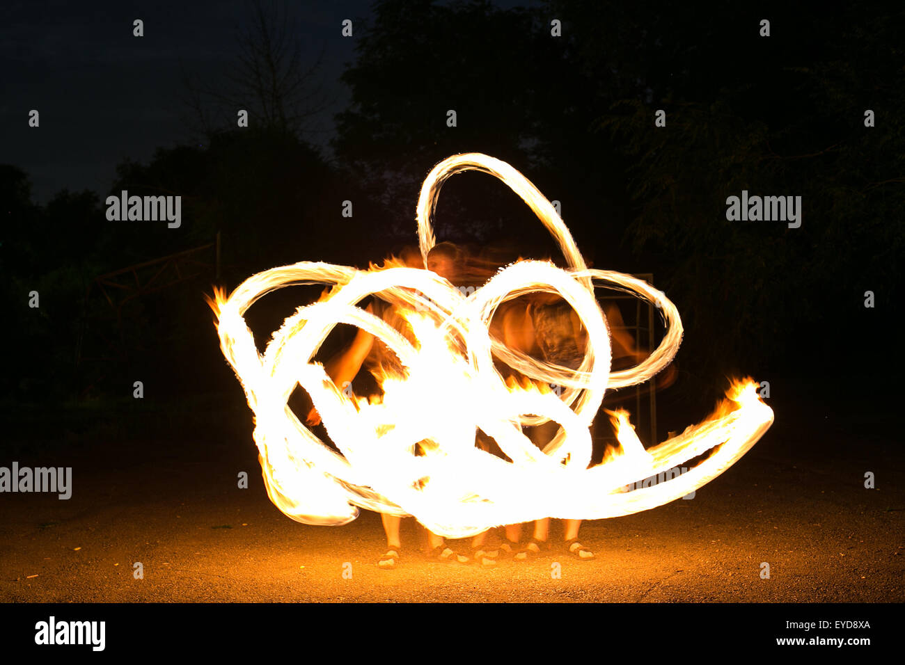 Fire-show man in action in night time Stock Photo - Alamy
