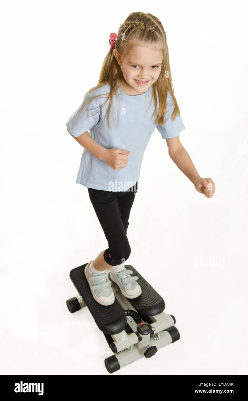 Six year old girl Europeans engaged in physical exercises Stock Photo ...
