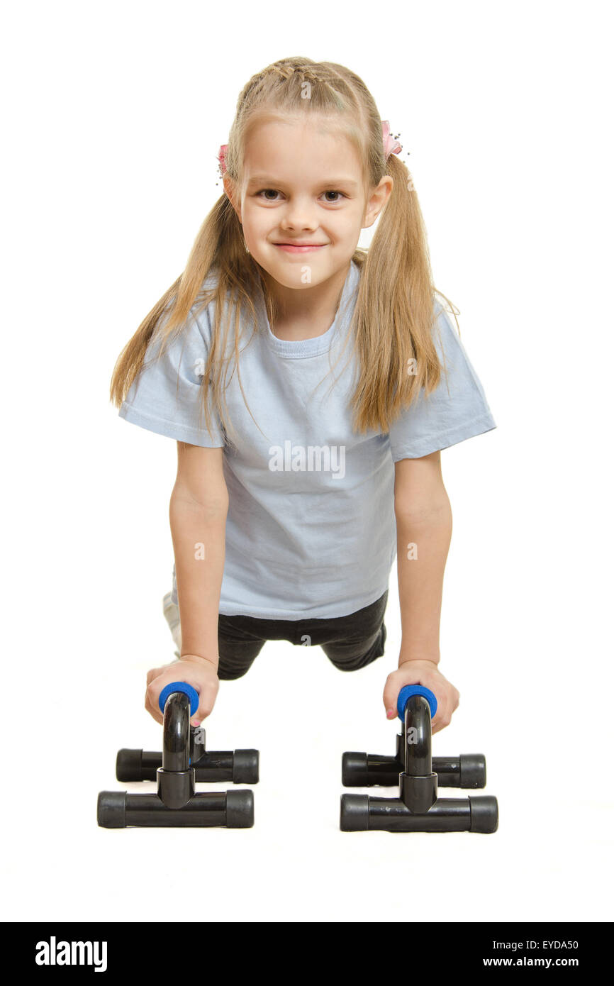 Six year old girl Europeans engaged in physical exercises Stock Photo ...