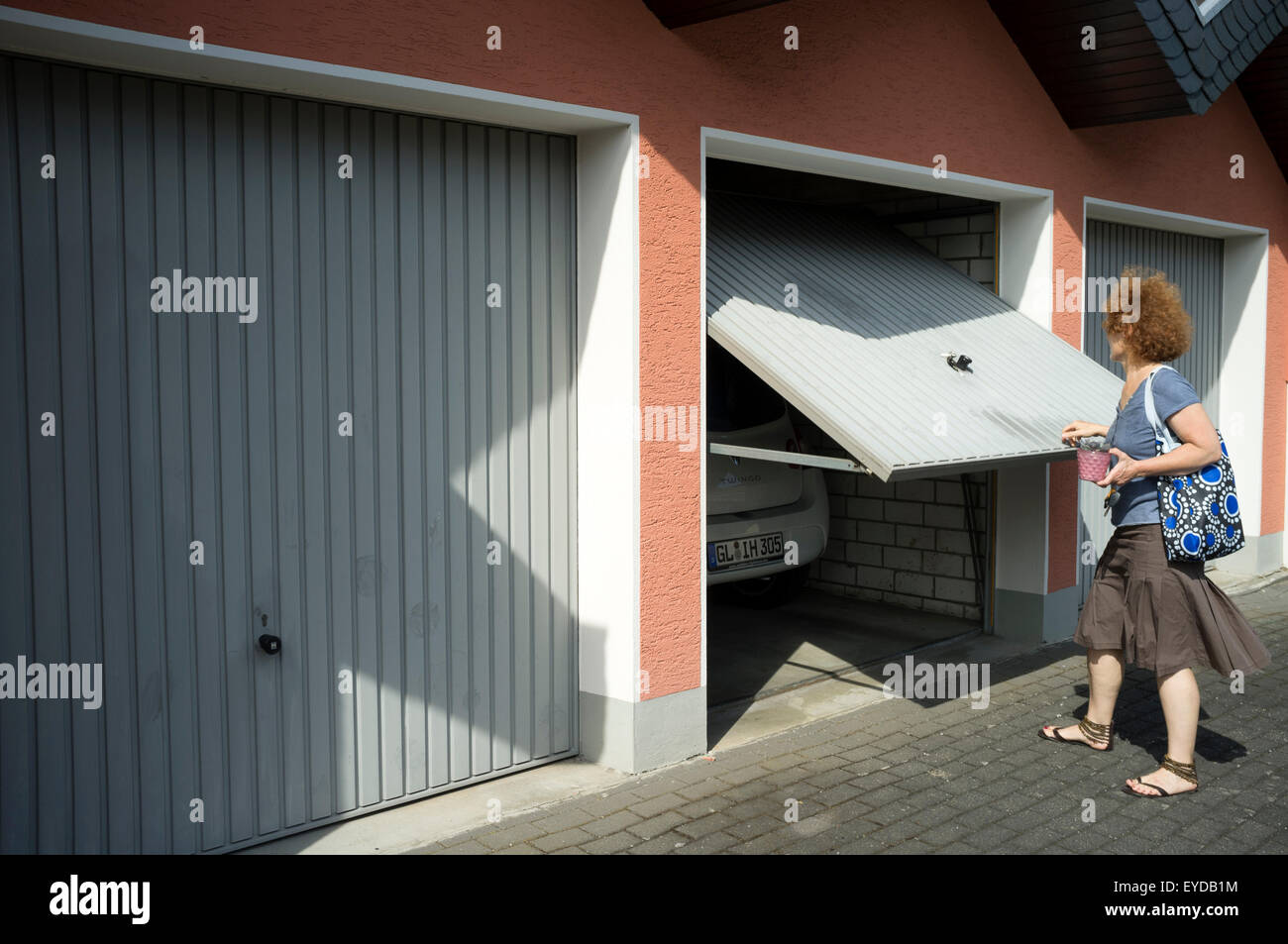 Opening garage door hi-res stock photography and images - Alamy