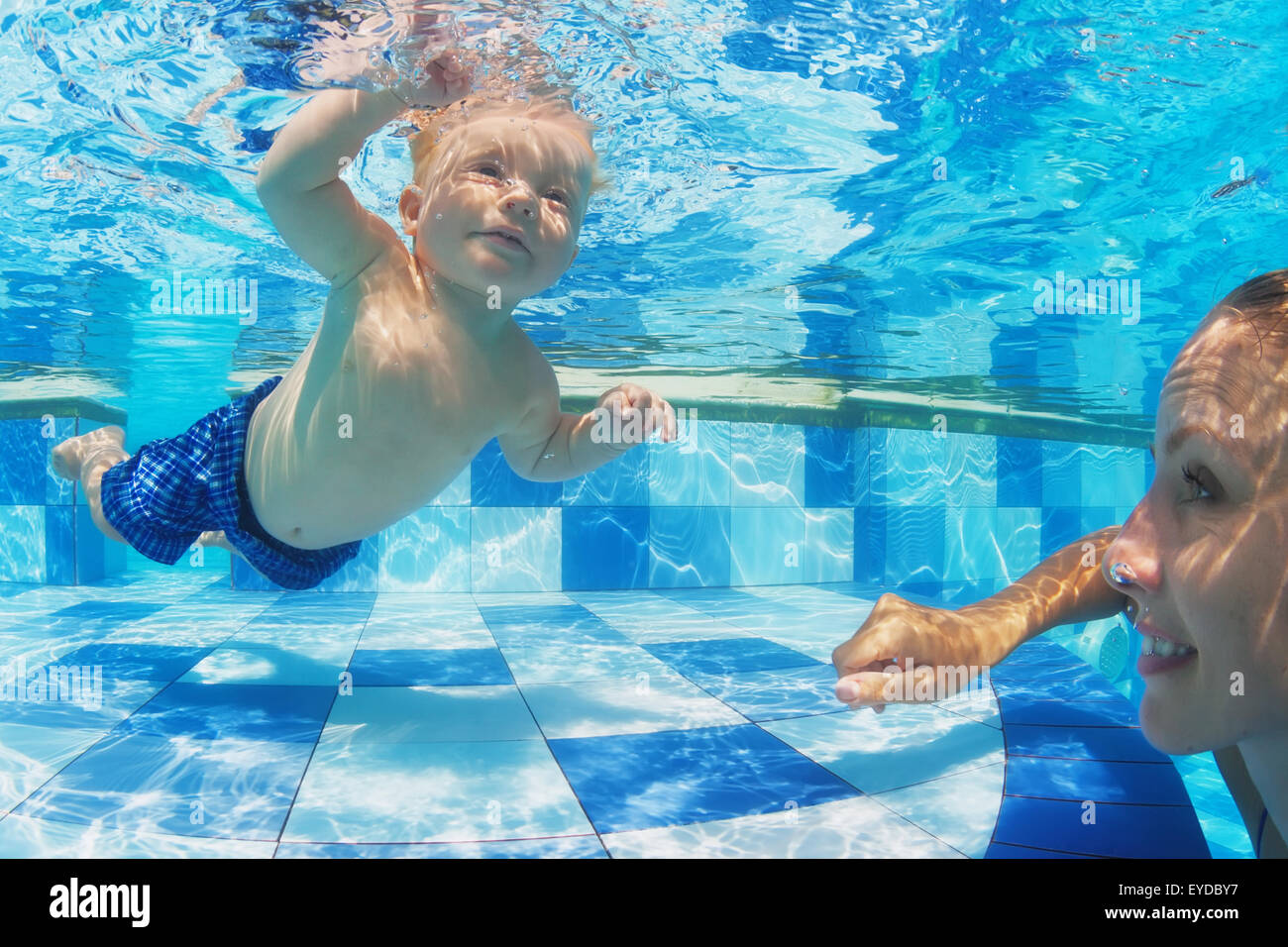 Woman jumping diving into pool hi-res stock photography and images - Alamy