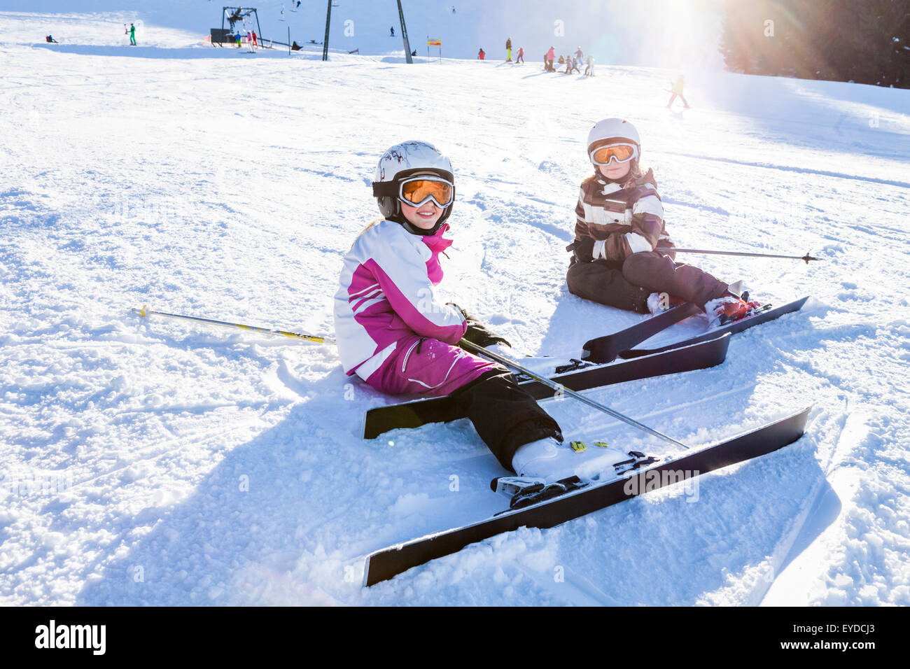 Ski holiday, Children resting on snow, Sudelfeld, Bavaria, Germany ...