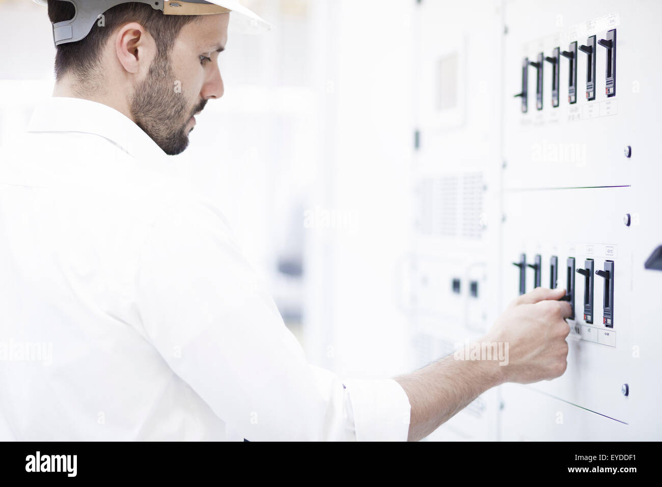 Engineer checking switch in electricity substation Stock Photo - Alamy