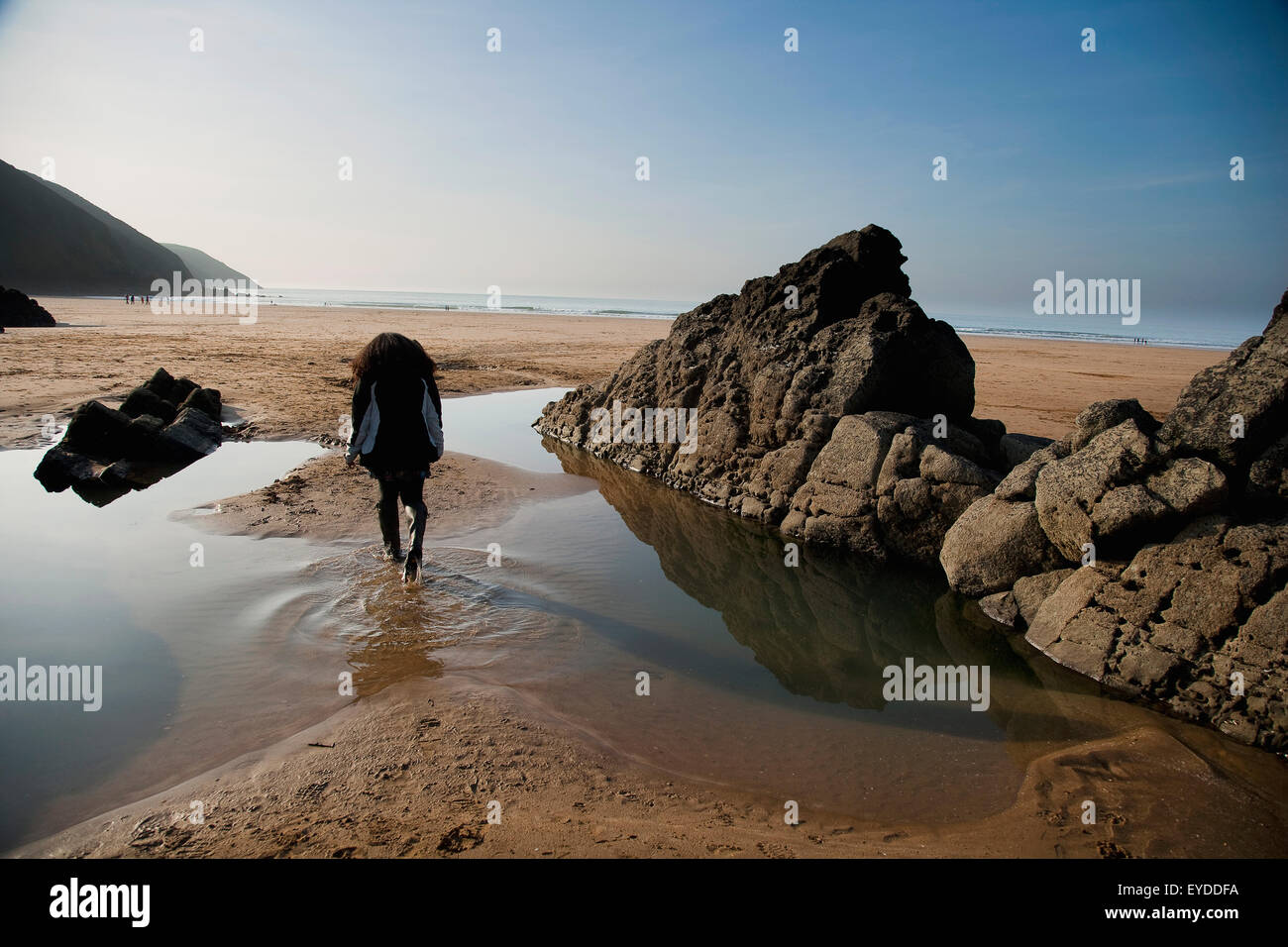 Large Rock Pool On The Beach Surrounded By Rocks In Putsborough Sands ...