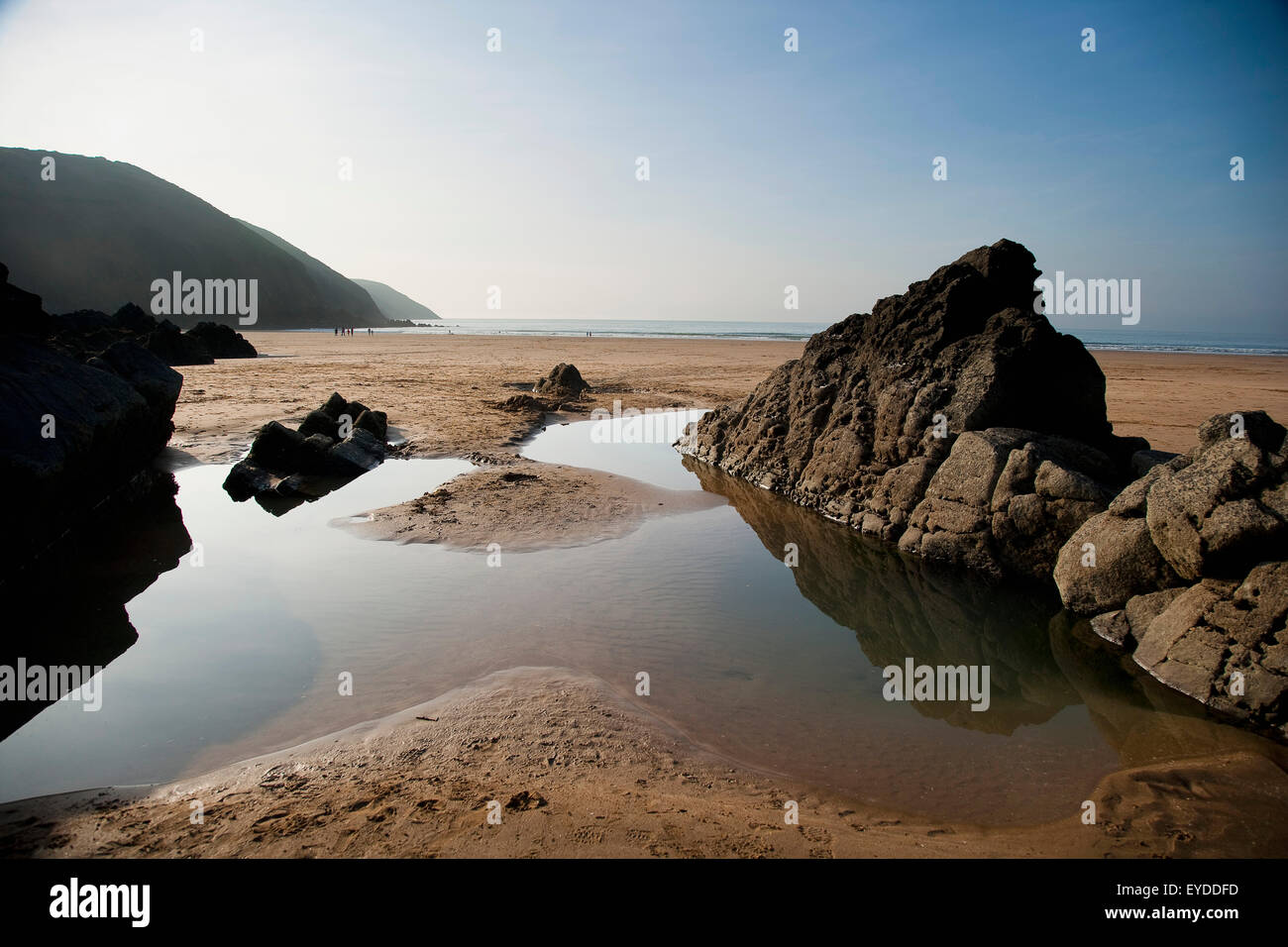 Large Rock Pool On The Beach Surrounded By Rocks In Putsborough Sands ...