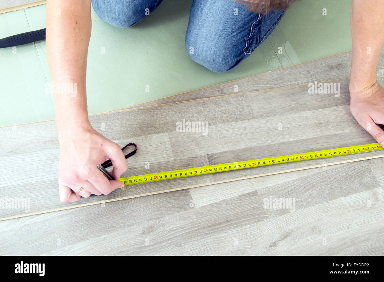 Man with Tools to Laying Laminate Stock Photo - Alamy