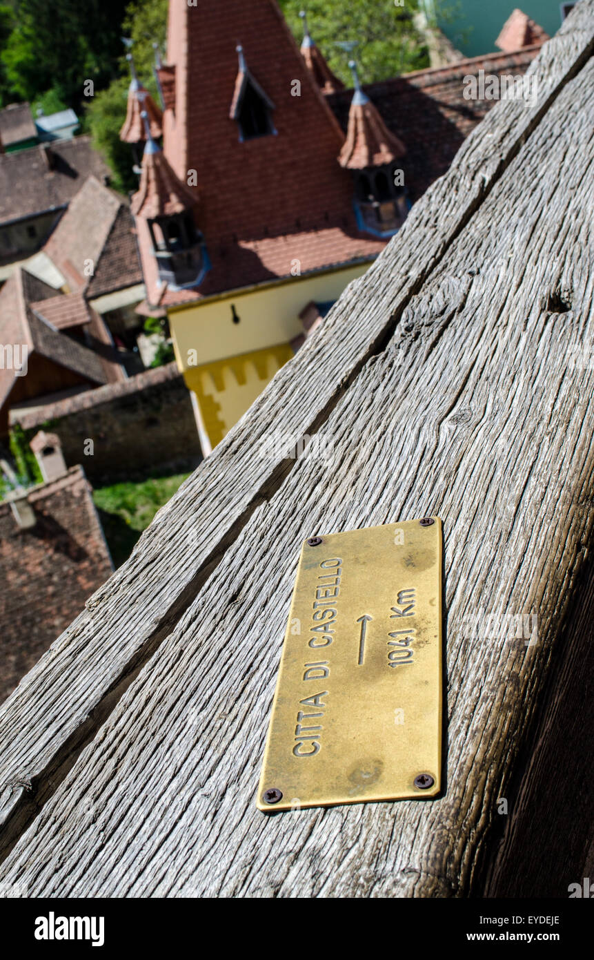 Sighișoara Tourist sign near medieval castle overlooking village in ...