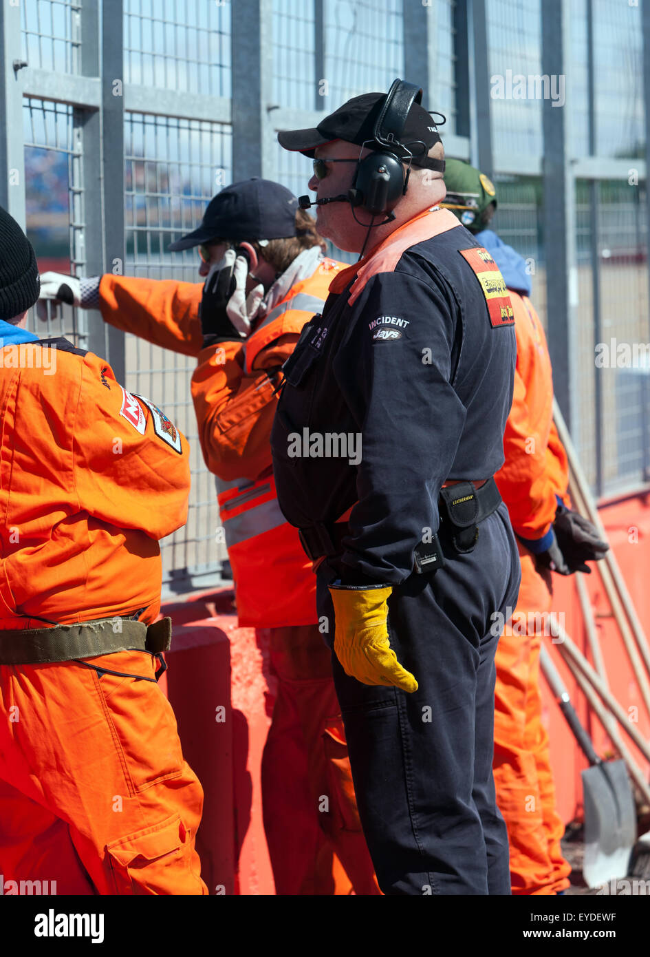View of the Silverstone trackside race marshals in action during a race ...