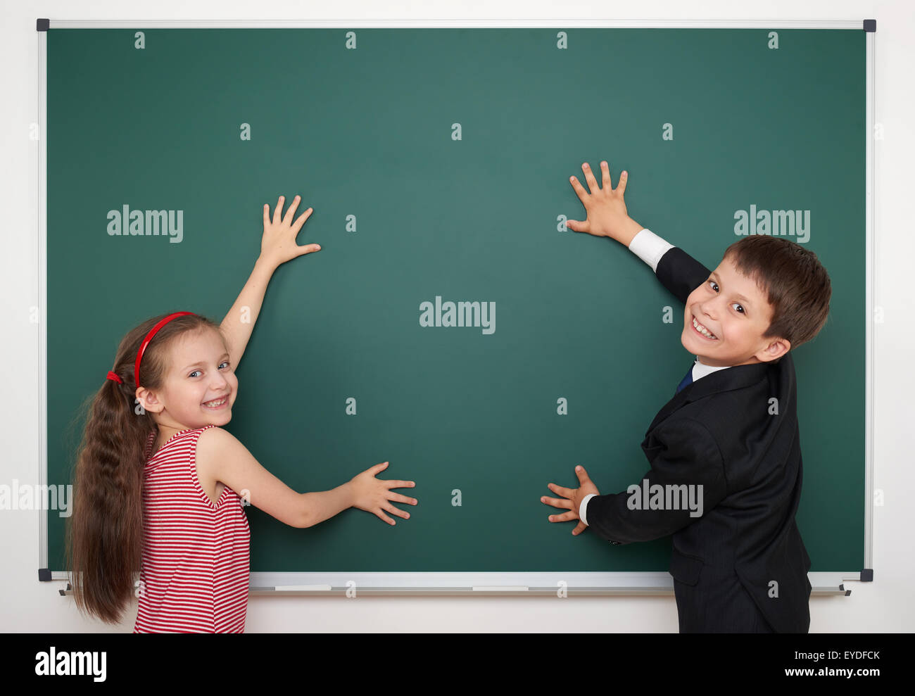 boy and girl write on school board Stock Photo - Alamy
