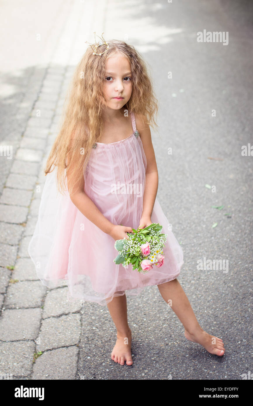 little girl with flowers. selective focus Stock Photo - Alamy