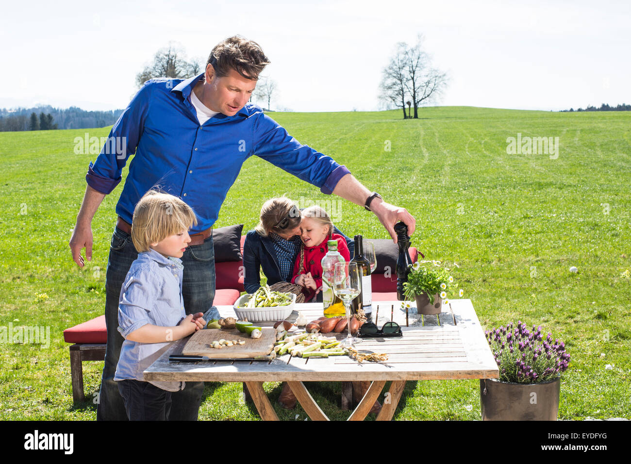 Family having barbecue hi-res stock photography and images - Alamy