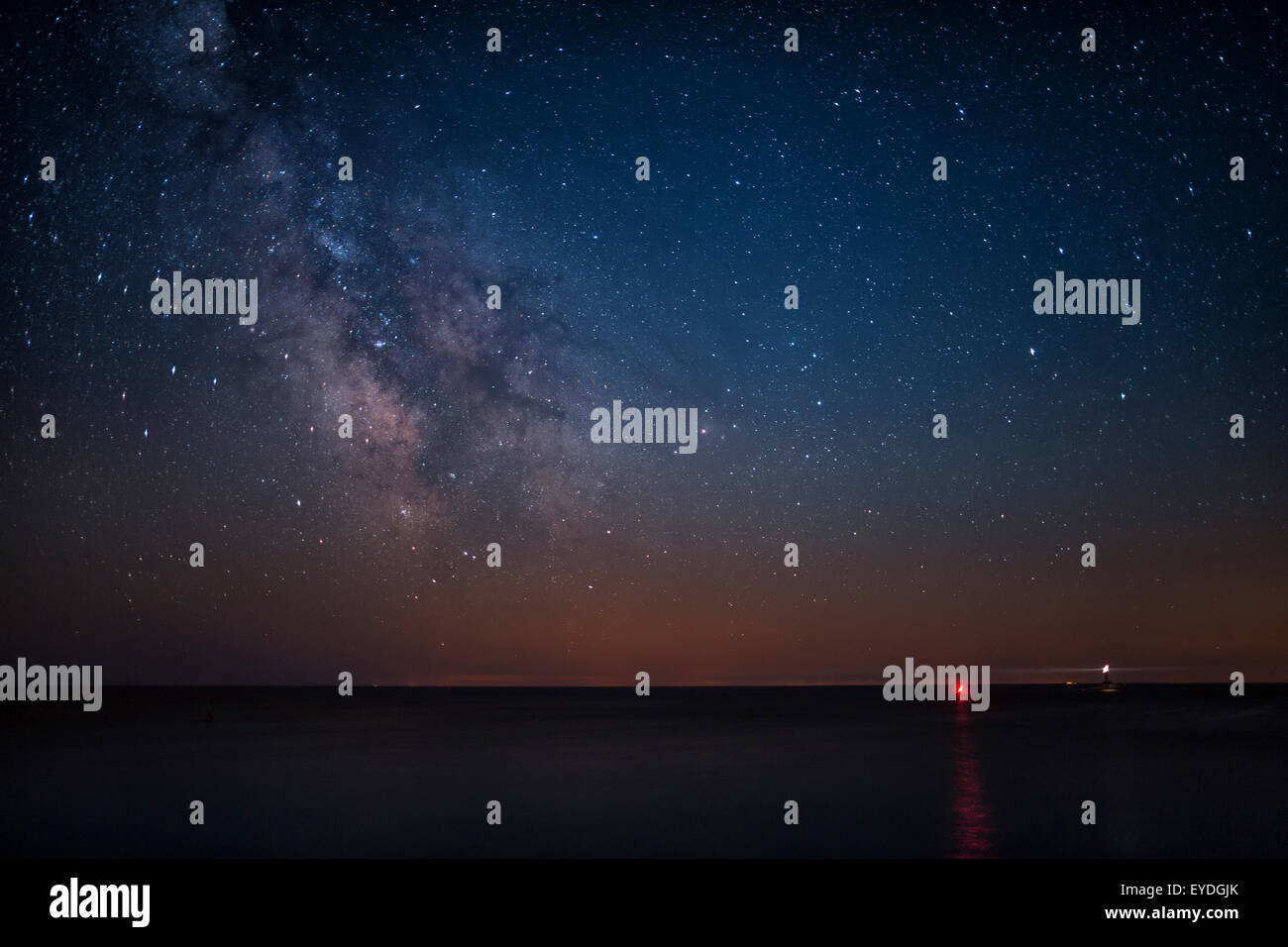 Starry night sky over seascape Stock Photo - Alamy
