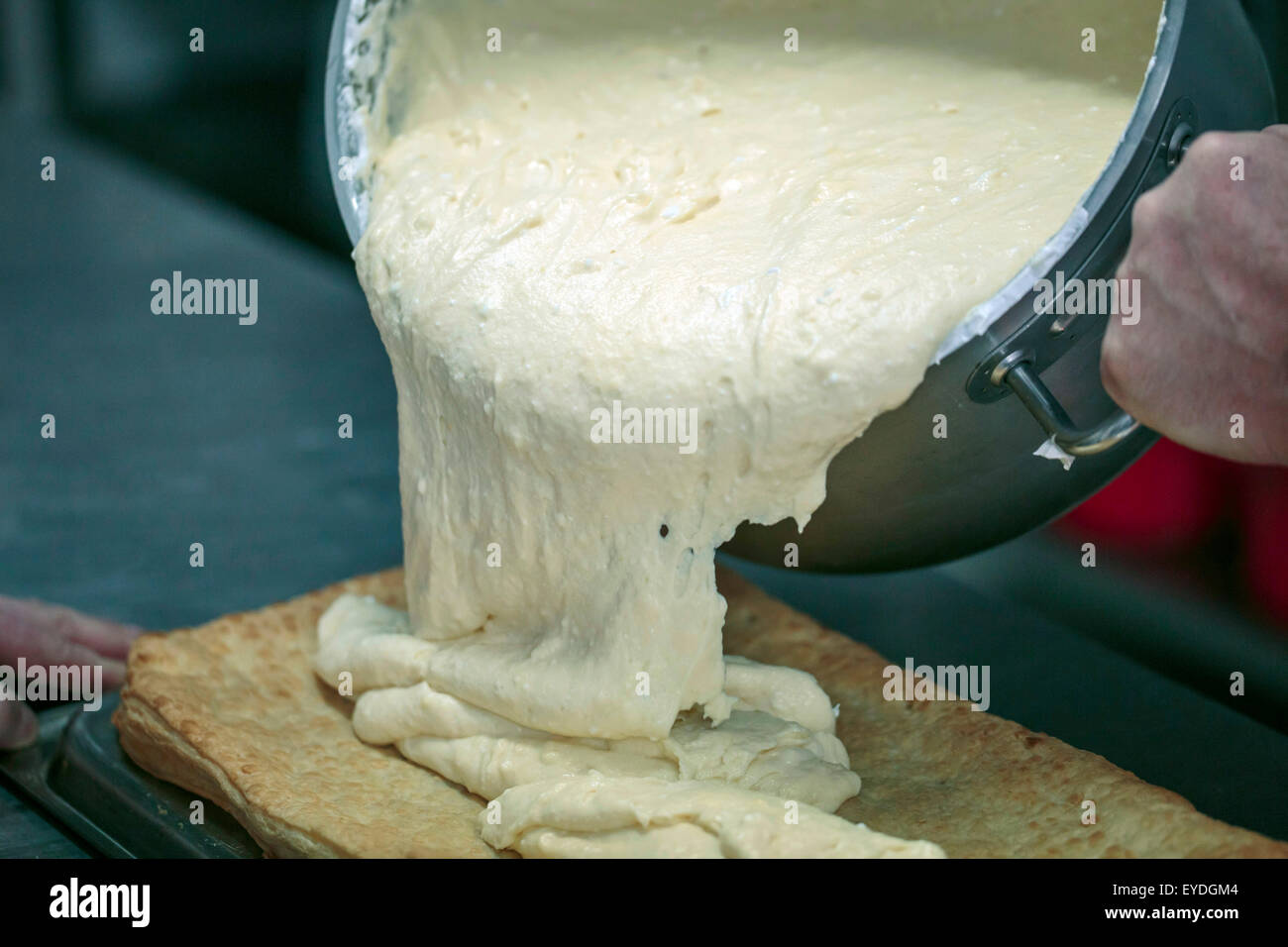 Spreading flan base with pastry dough Stock Photo - Alamy
