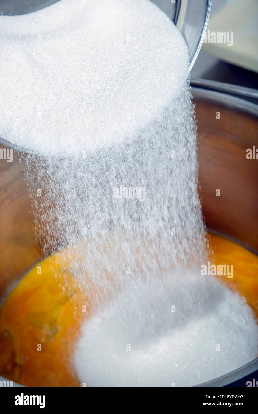 Pouring sugar into mixing bowl Stock Photo - Alamy Pouring sugar into mixing bowl Stock Photo - Alamy