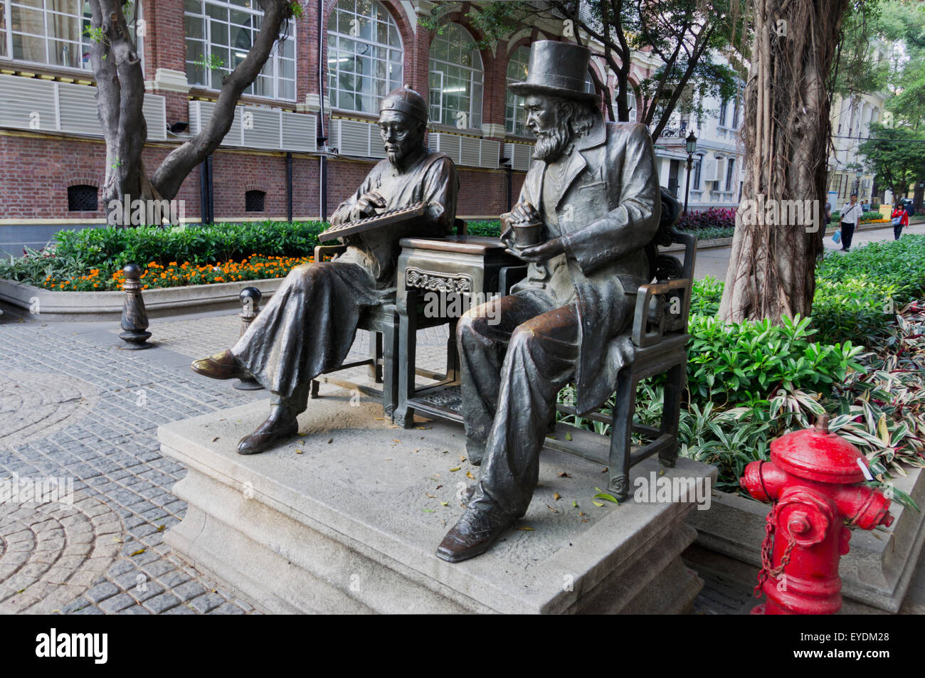 China, Guangdong, Shamian Island; Guangzhou, Statues on bench Stock ...