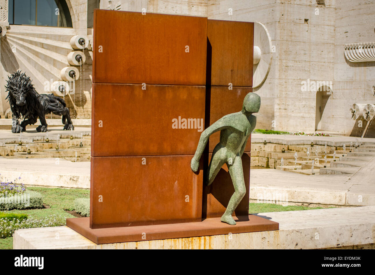 Yerevan Cascade Abstract sculpture of a figure emerging from a wall in ...