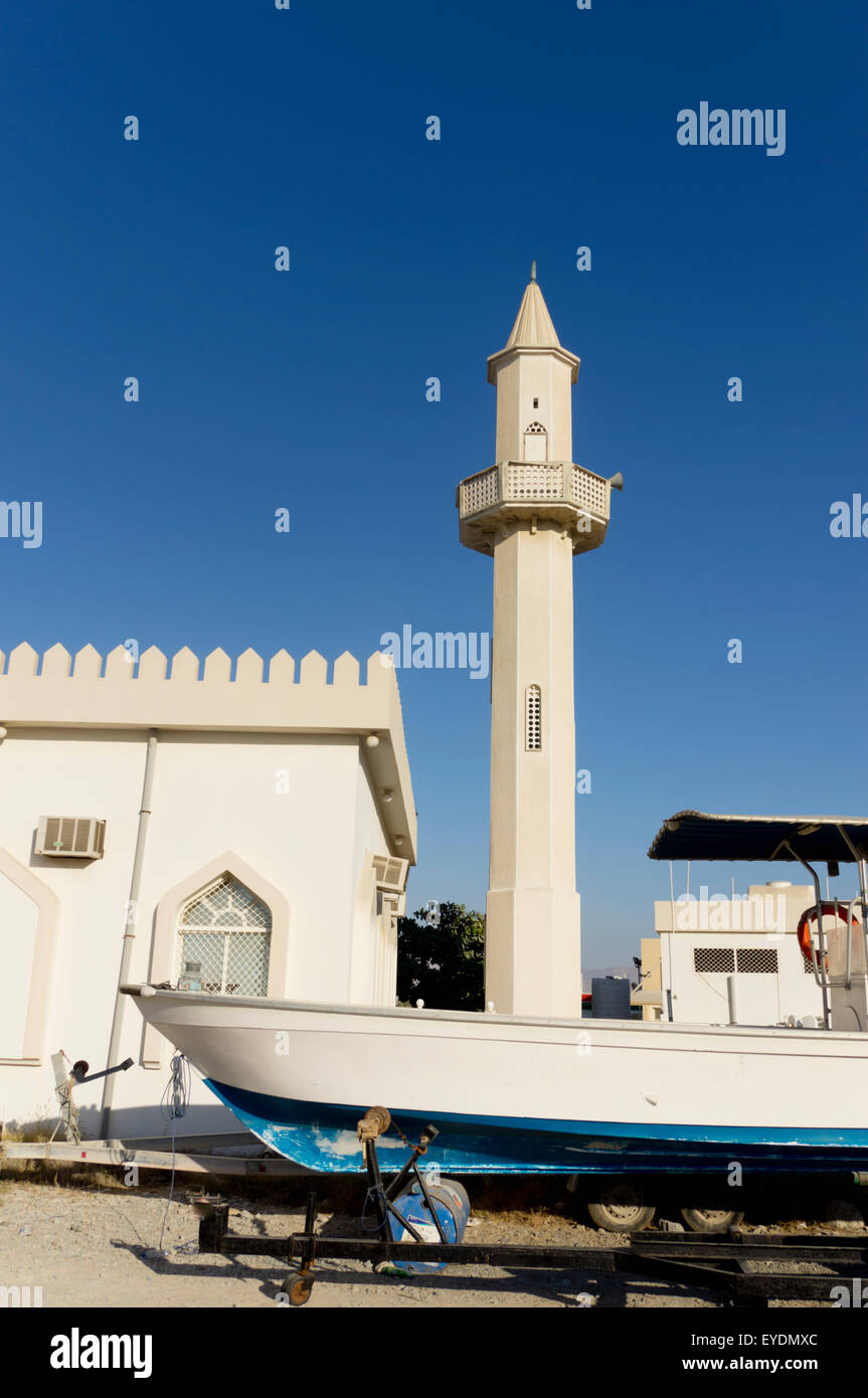 United Arab Emirates, Boat in front of mosque; Ras Al Khaimah Stock ...