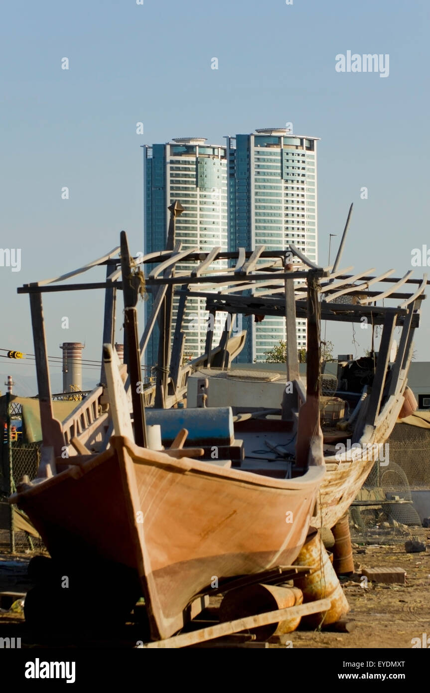 United Arab Emirates, View of old dhow and skyscraper in background ...