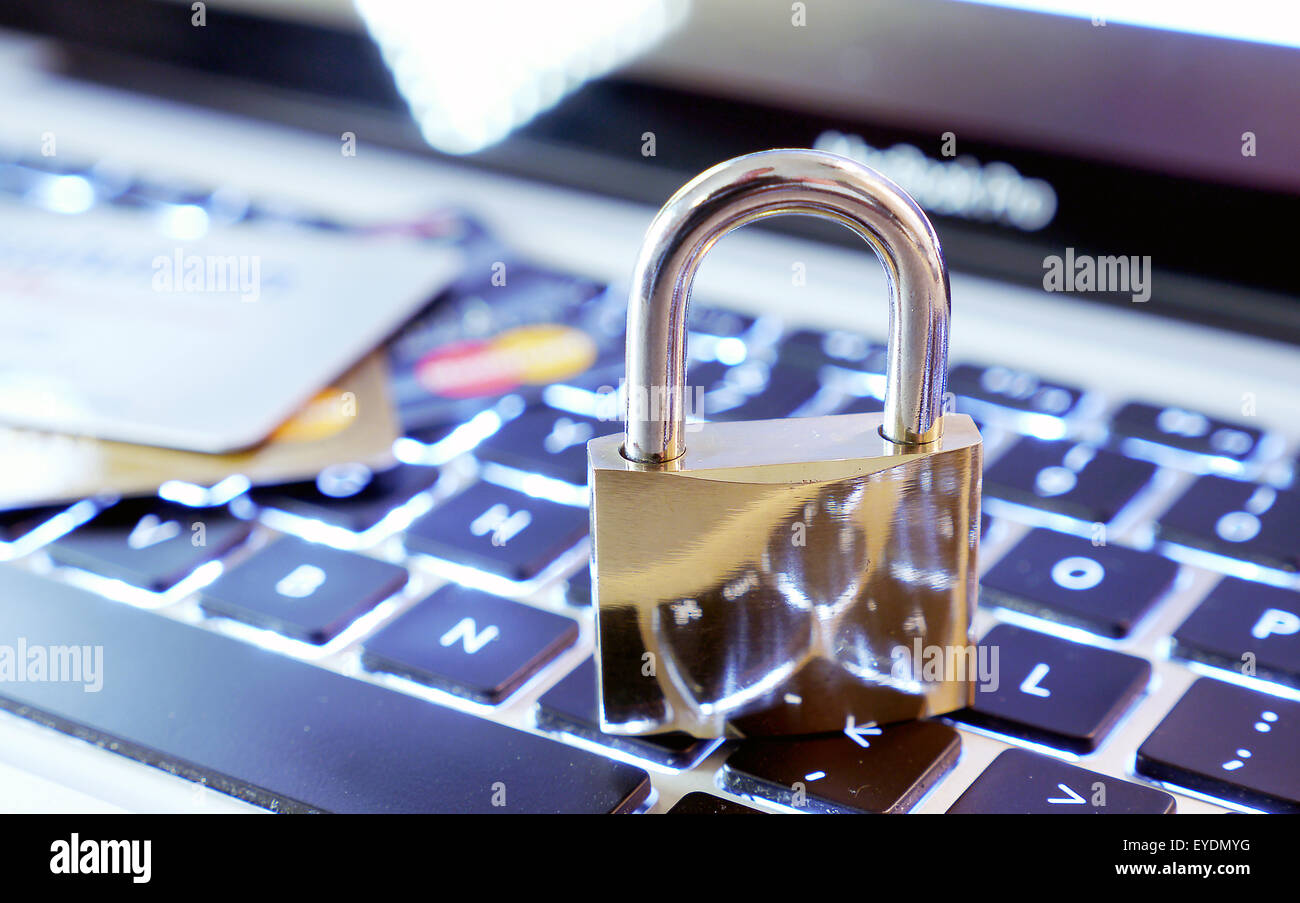 big lock and credit cards on a computer keyboard Stock Photo - Alamy