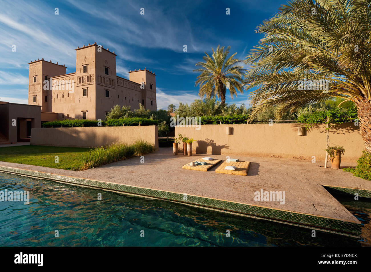 Morocco, Swimming pool of Dar Ahlam Hotel with main kasbah in ...