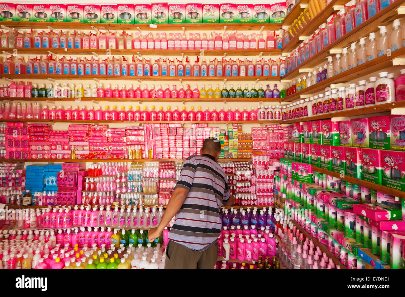 Morocco, Valley of the Roses, Man in shop selling rose products; Kalaat ...