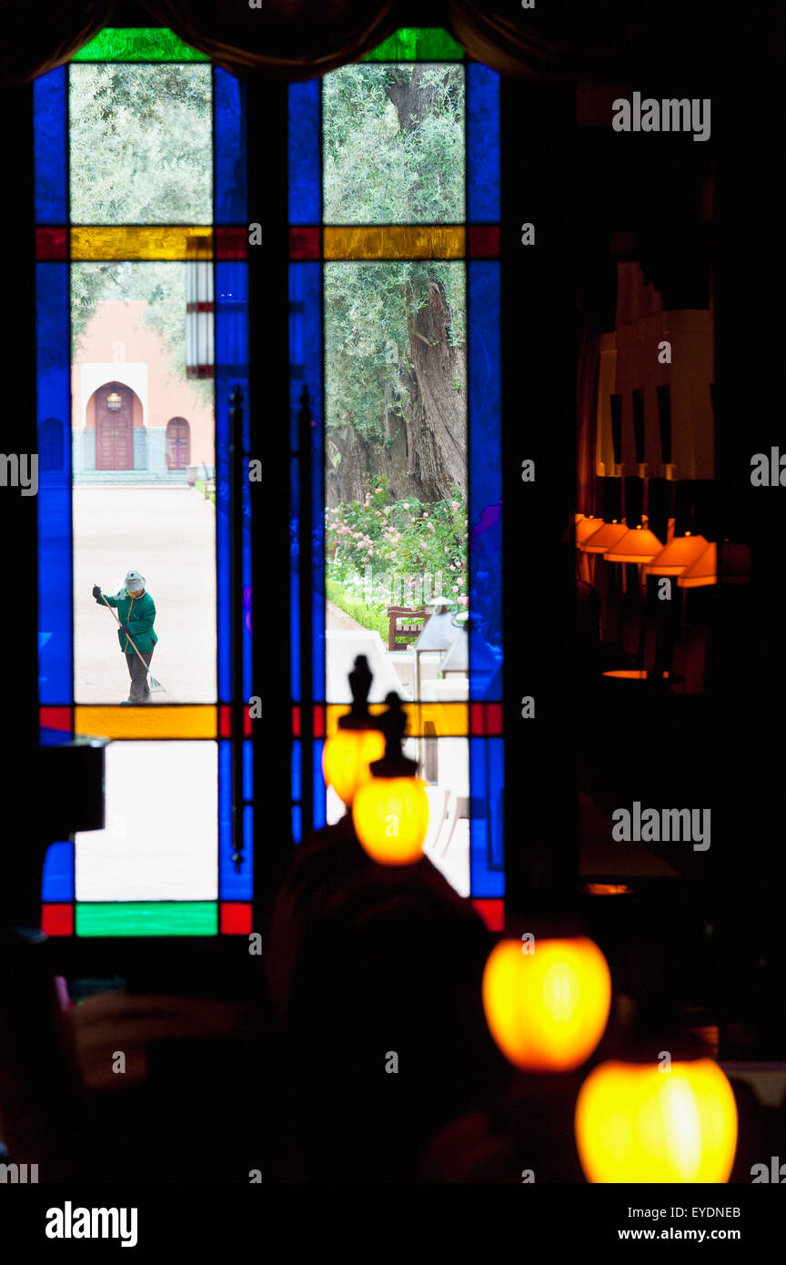 Morocco, Garden seen through stained glass window; Marrakech Stock ...