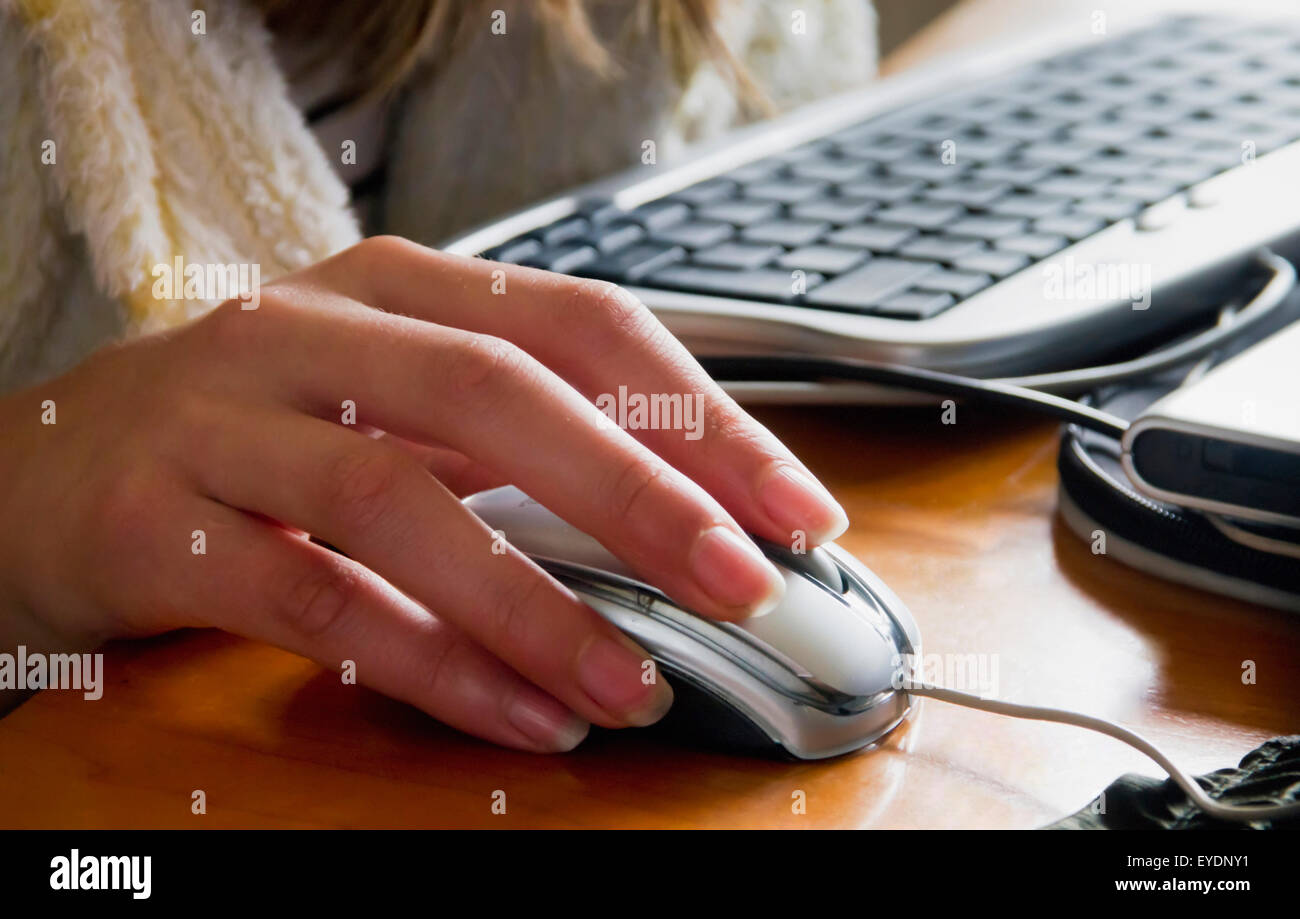 United Kingdom, England, Girl hand on computer mouse; Esher Stock Photo ...