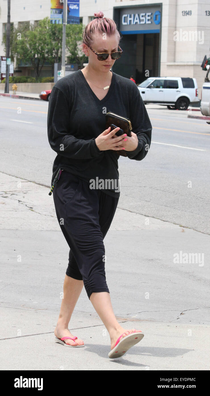 Kaley Cuoco has her eyebrows and hair dyed pink with her hair tied back ...