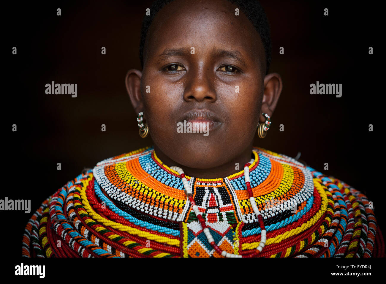 Kenya, Portrait of young Samburu woman in traditional dress; South Horr ...